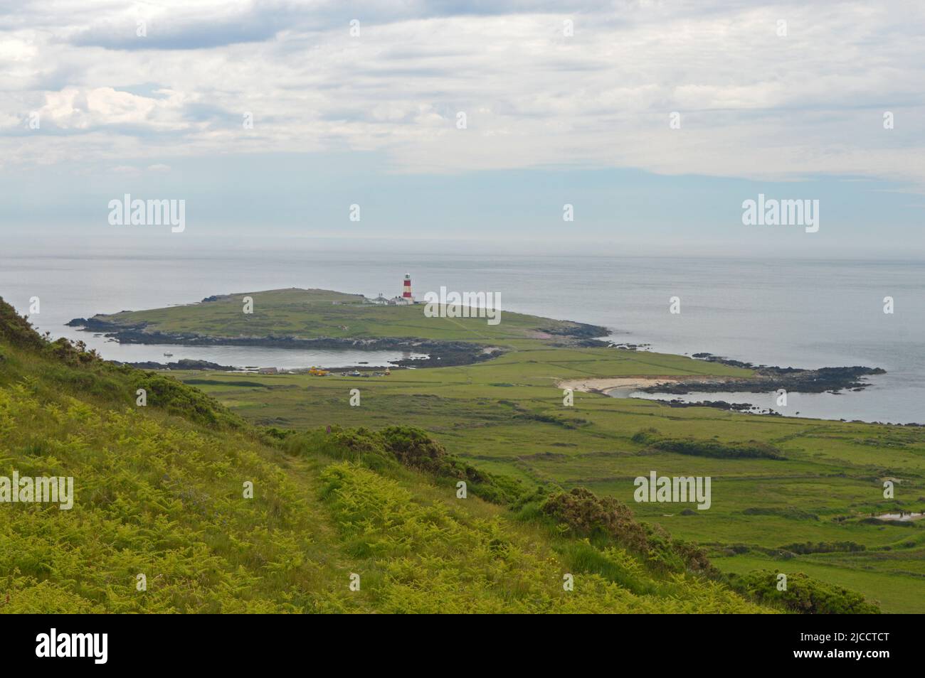 Bardsey Island lighthouse and coastline Stock Photo - Alamy