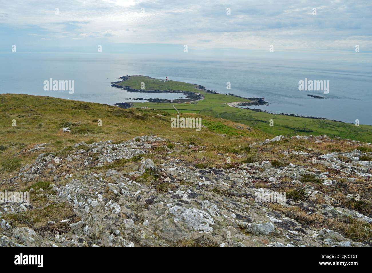 Bardsey Island lighthouse and coastline Stock Photo - Alamy