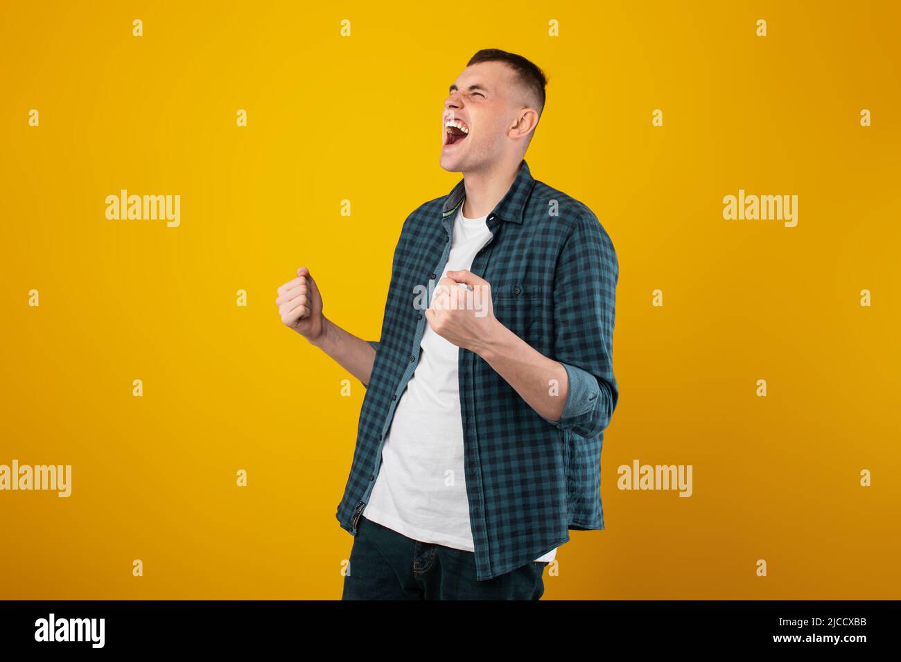 Excited man celebrating win on hi-res stock photography and images - Alamy