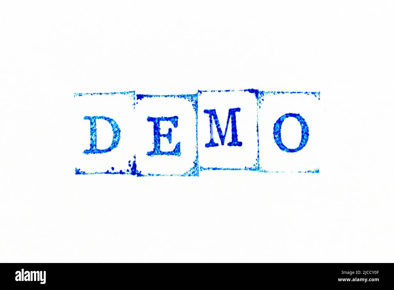 Blue color ink rubber stamp in word demo on white paper background ...