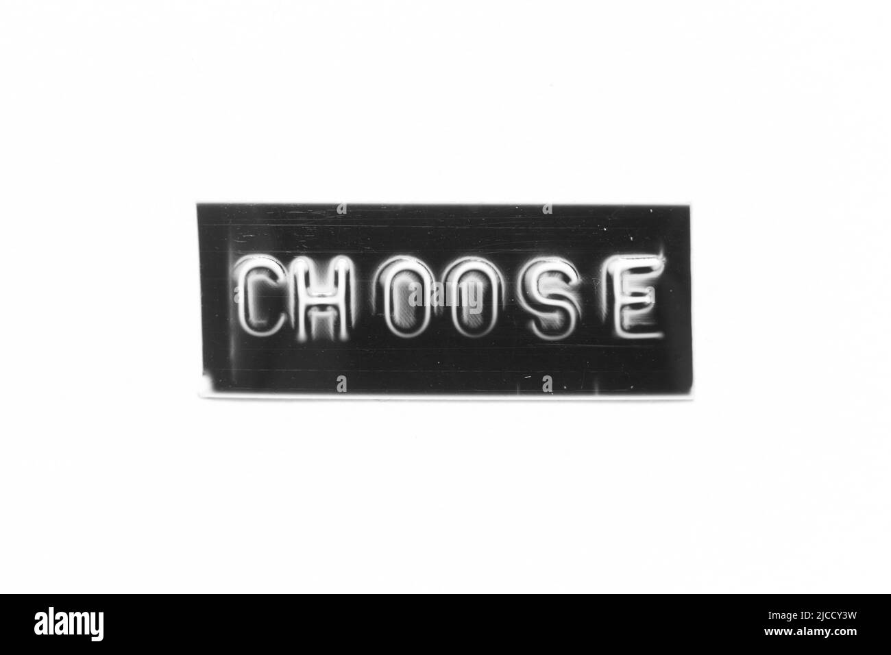 Black color banner that have embossed letter with word choose on white ...