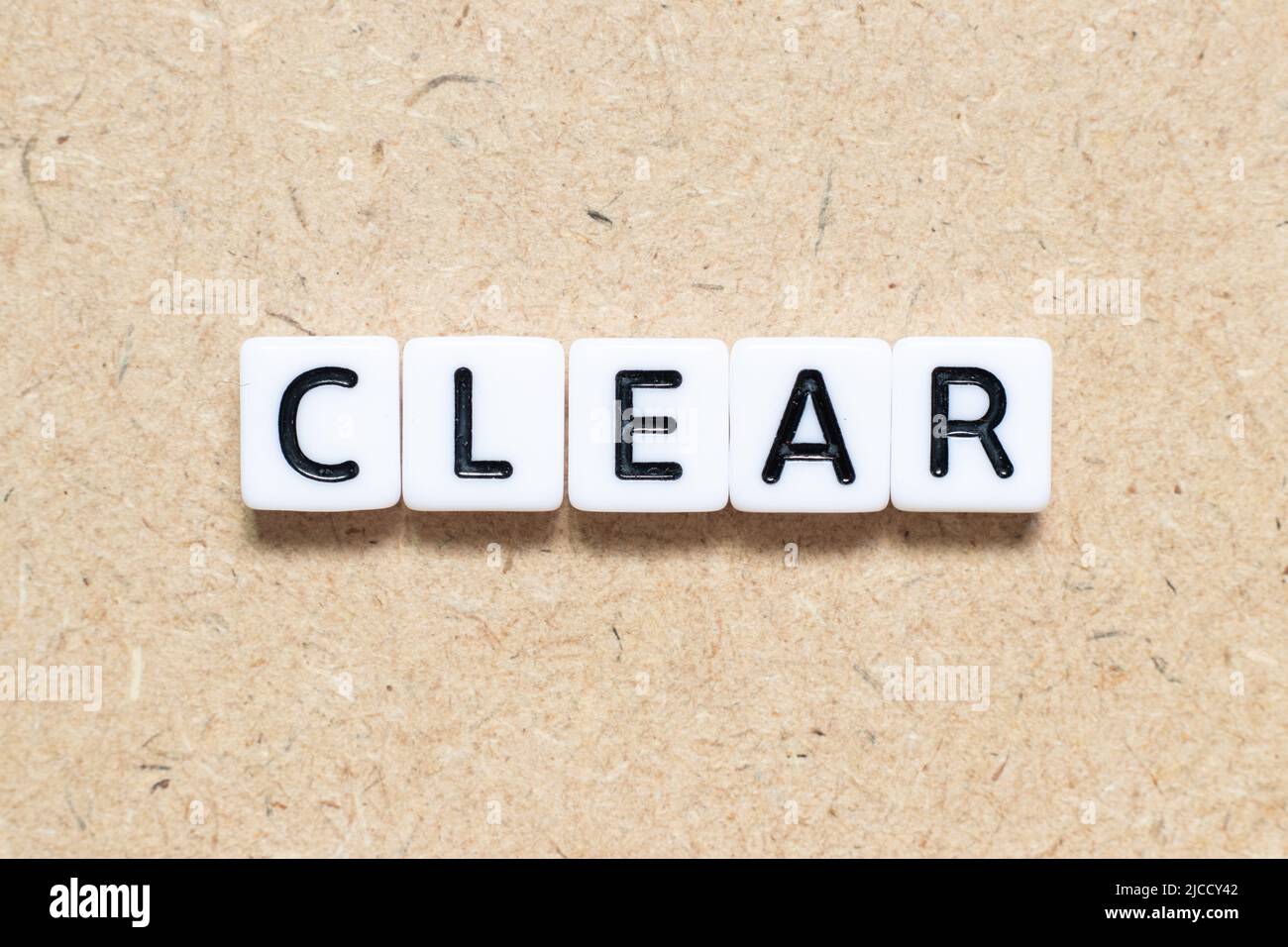 White tile alphabet letter with word clear on wood background Stock ...