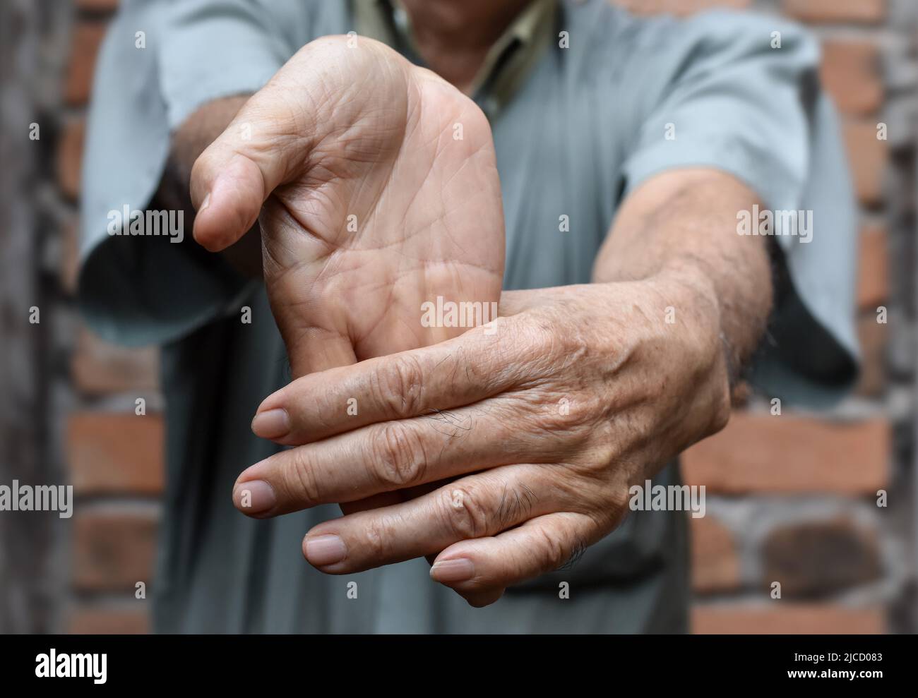 Strengthening exercise for arm muscles of Asian elder male patient with ...