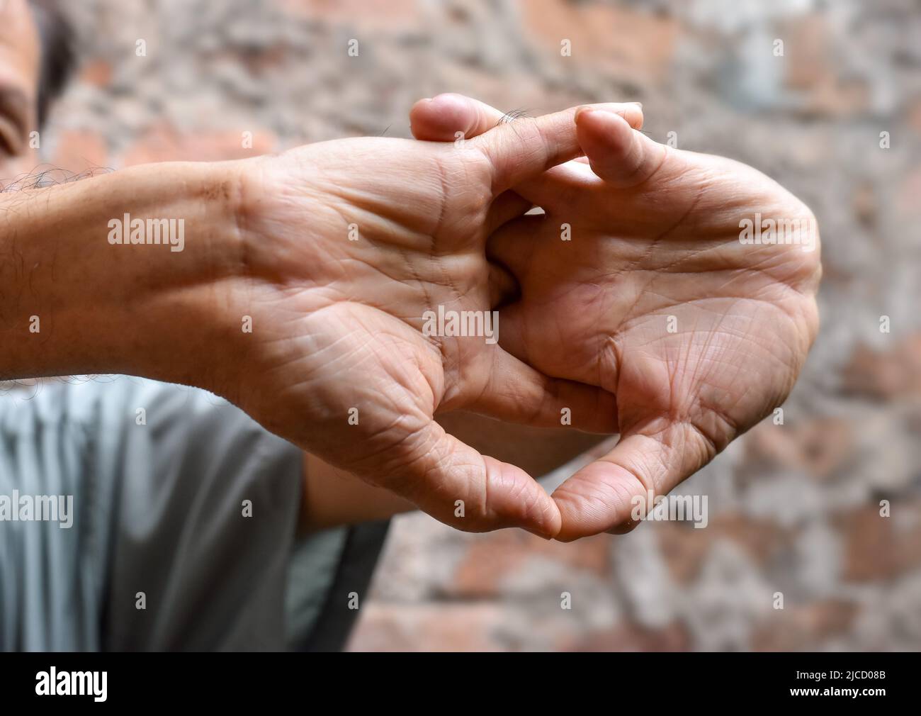 Strengthening exercise for arm muscles of Asian elder male patient with ...