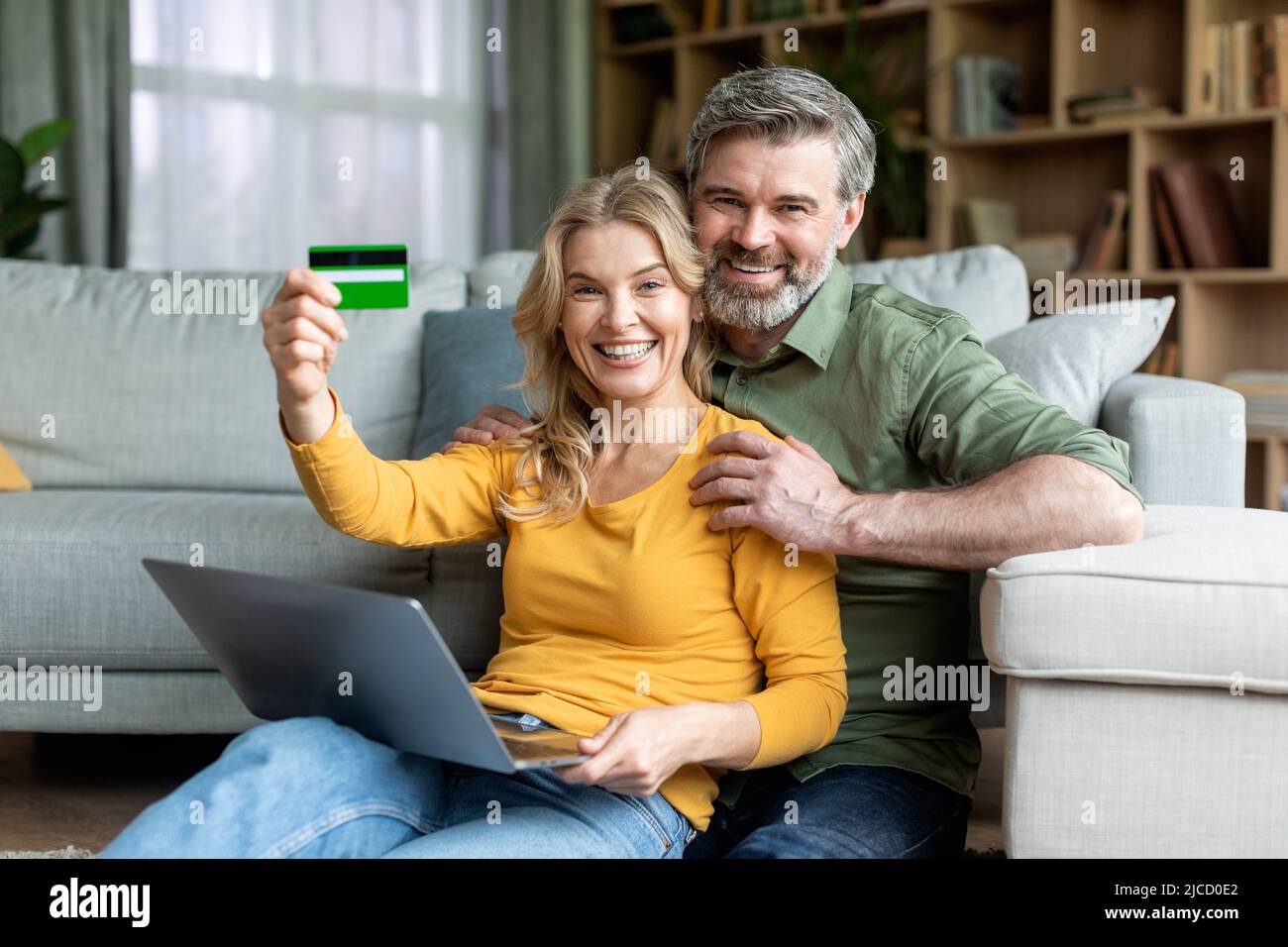 Online Banking. Portrait Of Middle Aged Couple With Laptop And Credit ...