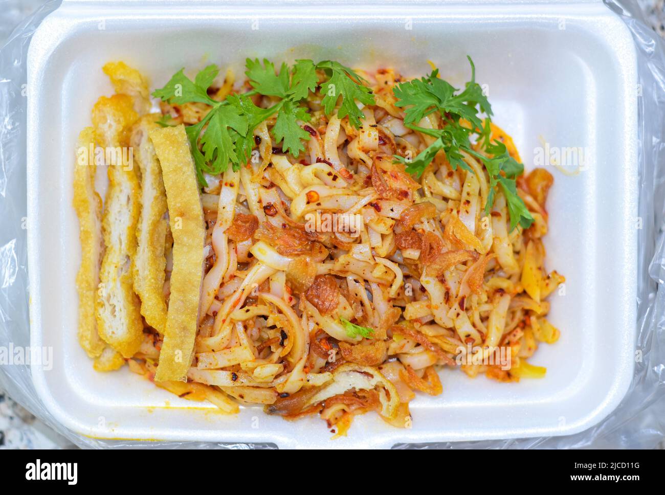 Myanmar traditional or classic white flat noodle salad called Khauk Swe ...