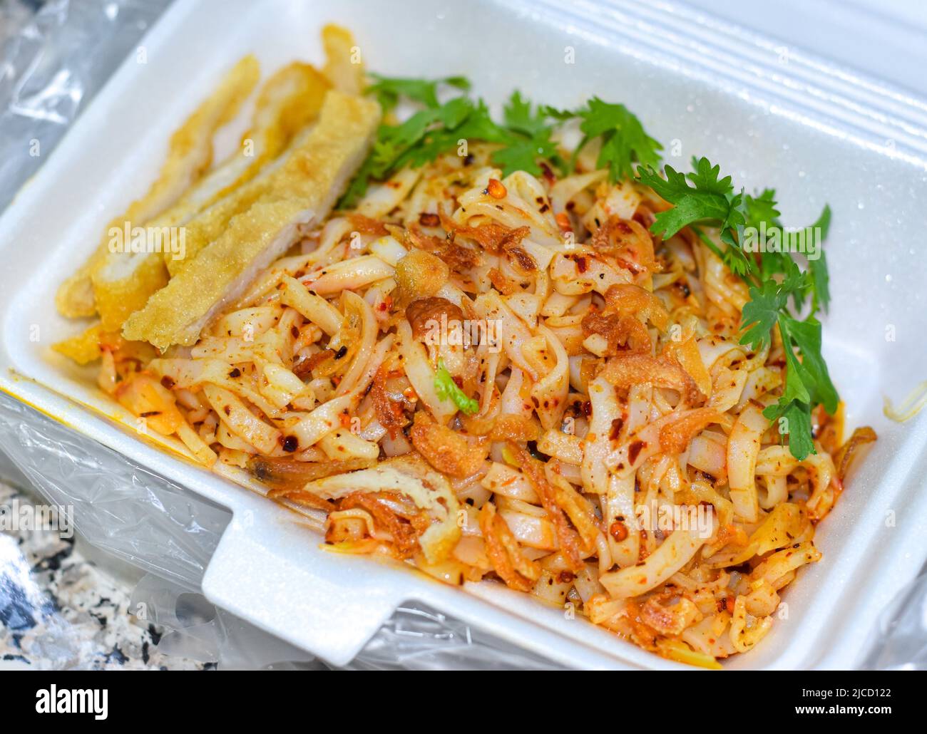 Myanmar traditional or classic white flat noodle salad called Khauk Swe ...