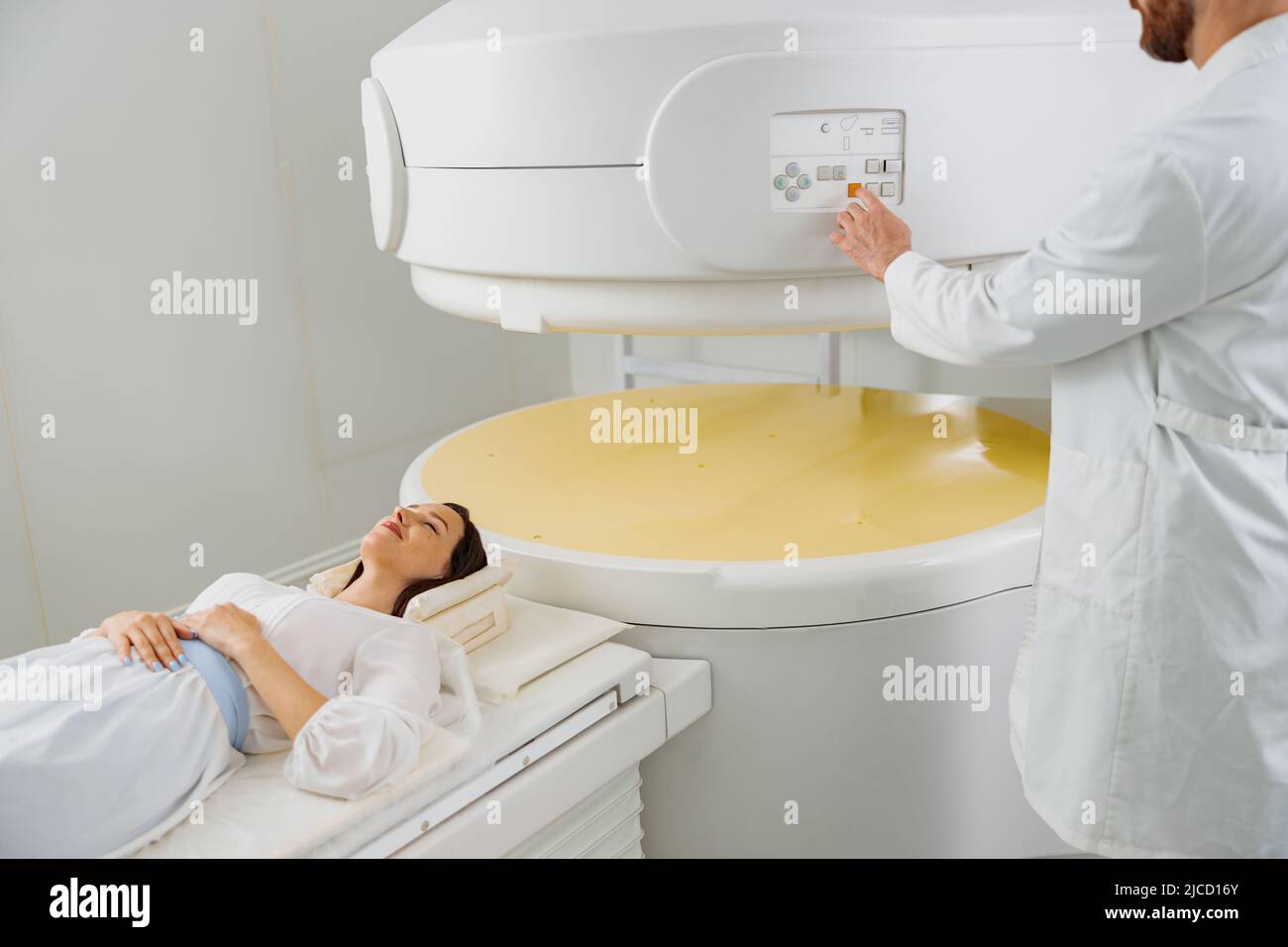Woman patient is ready to do magnetic resonance imaging MRI or CT scan ...