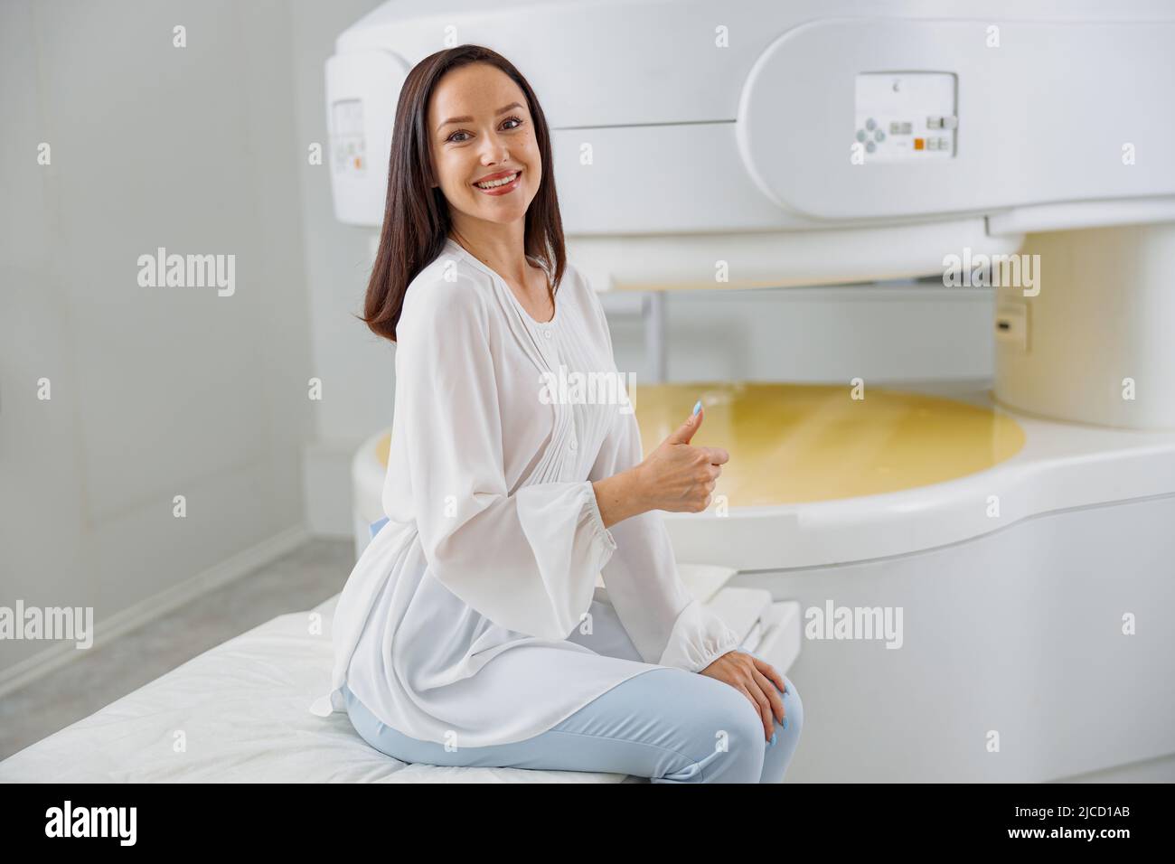 Happy patient after doing magnetic resonance imaging MRI or CT scan in ...