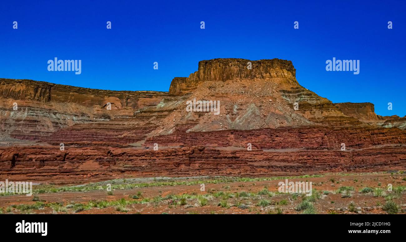 Layered geological formations of red rocks in Canyonlands National Park ...