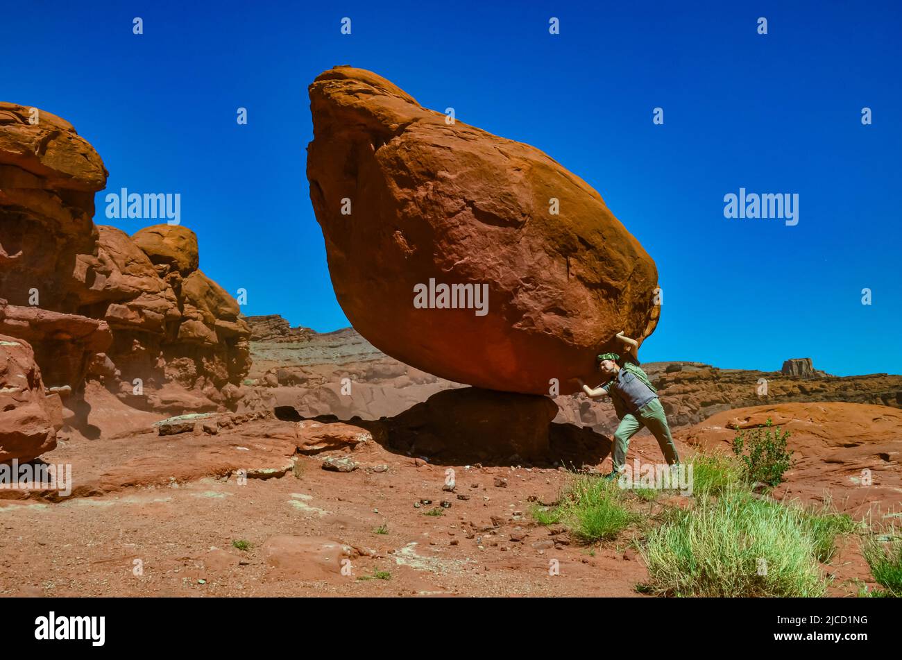 Balancing rock at the bottom of a canyon among Layered geological ...