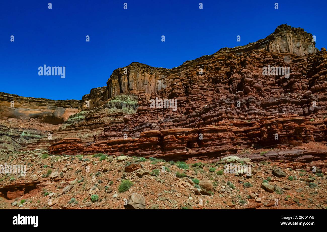 Layered geological formations of red rocks in Canyonlands National Park ...