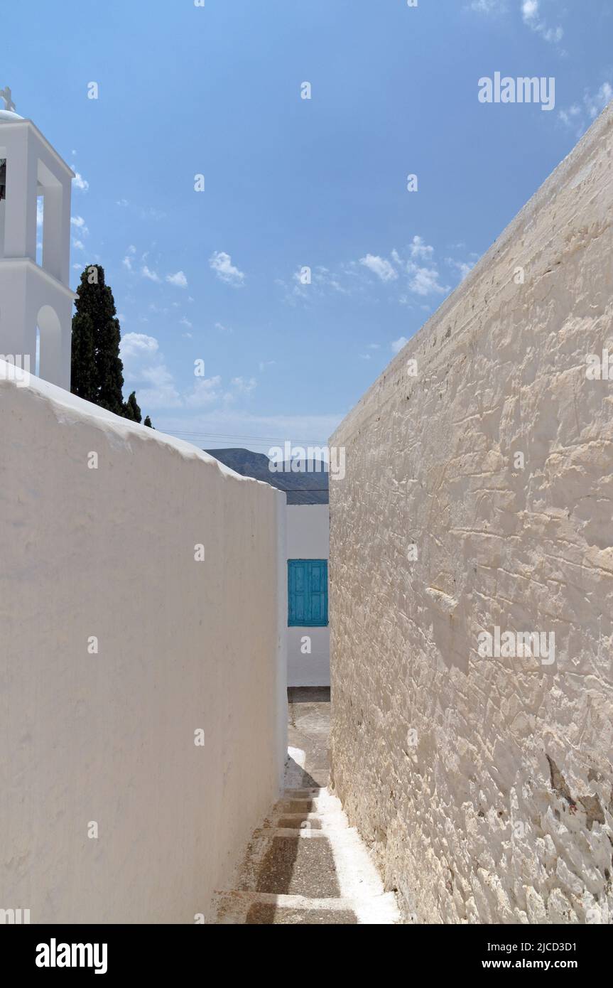View of Megalo Chorio mountain village, Tilos, Narrow alleyway between ...