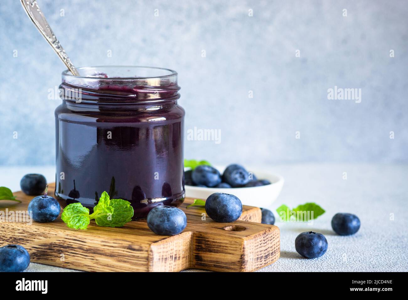 Blueberry jam in the glass jar with fresh berries Stock Photo - Alamy