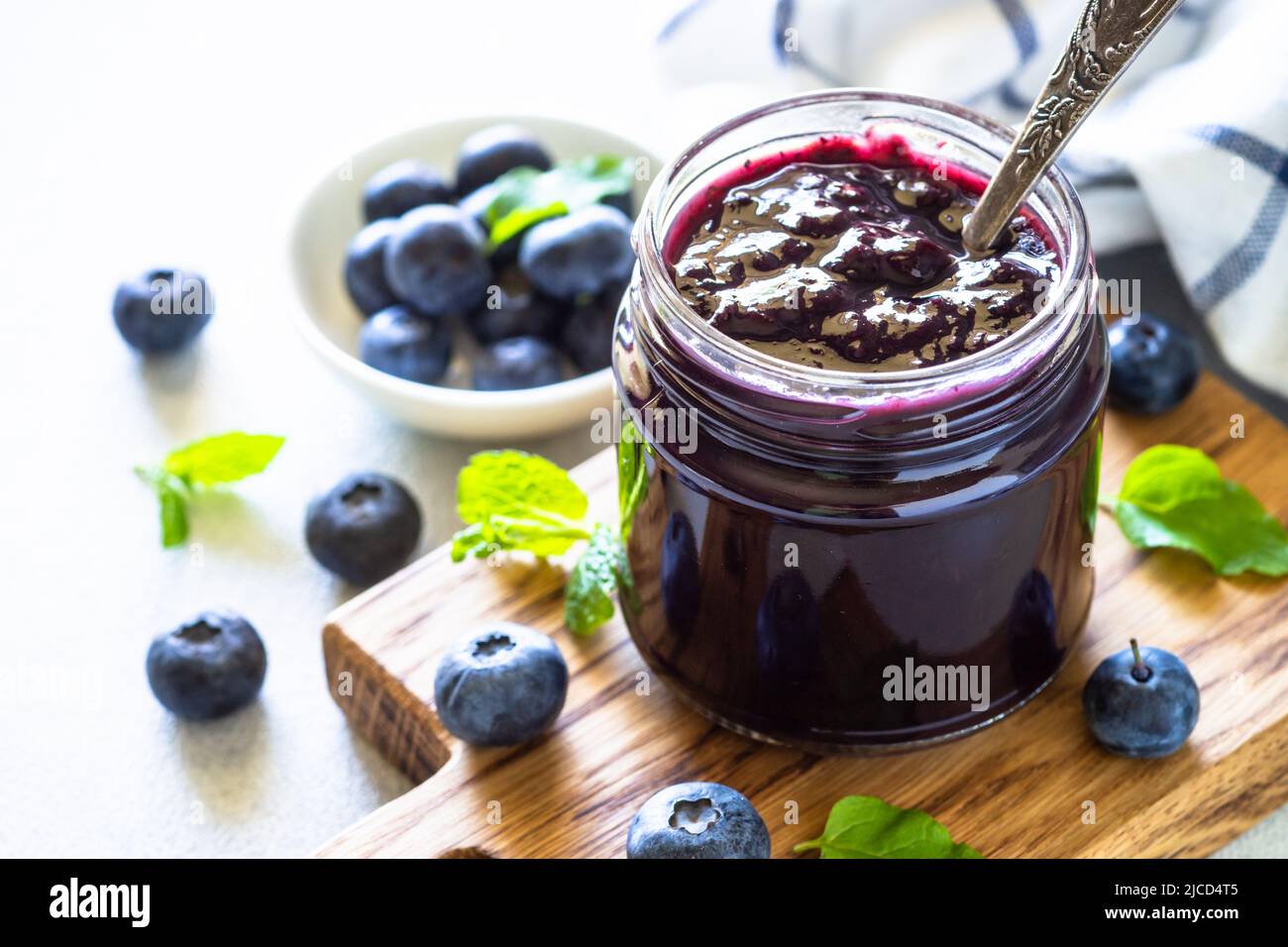 Blueberry jam in the glass jar with fresh berries Stock Photo - Alamy
