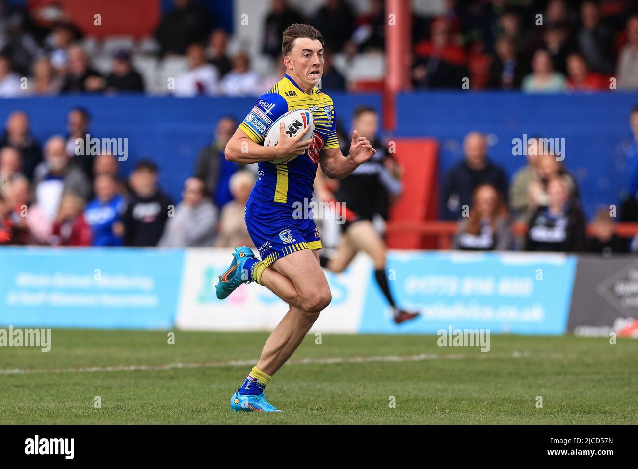 Matty Ashton #5 of Warrington Wolves makes a 60 yard dash for a solo ...