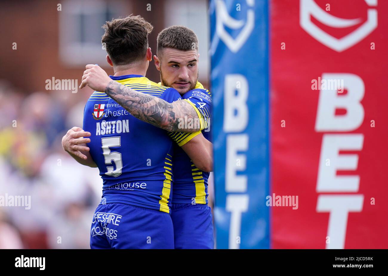 Warrington Wolves' Matty Ashton celebrates with team-mate Connor Wrench ...