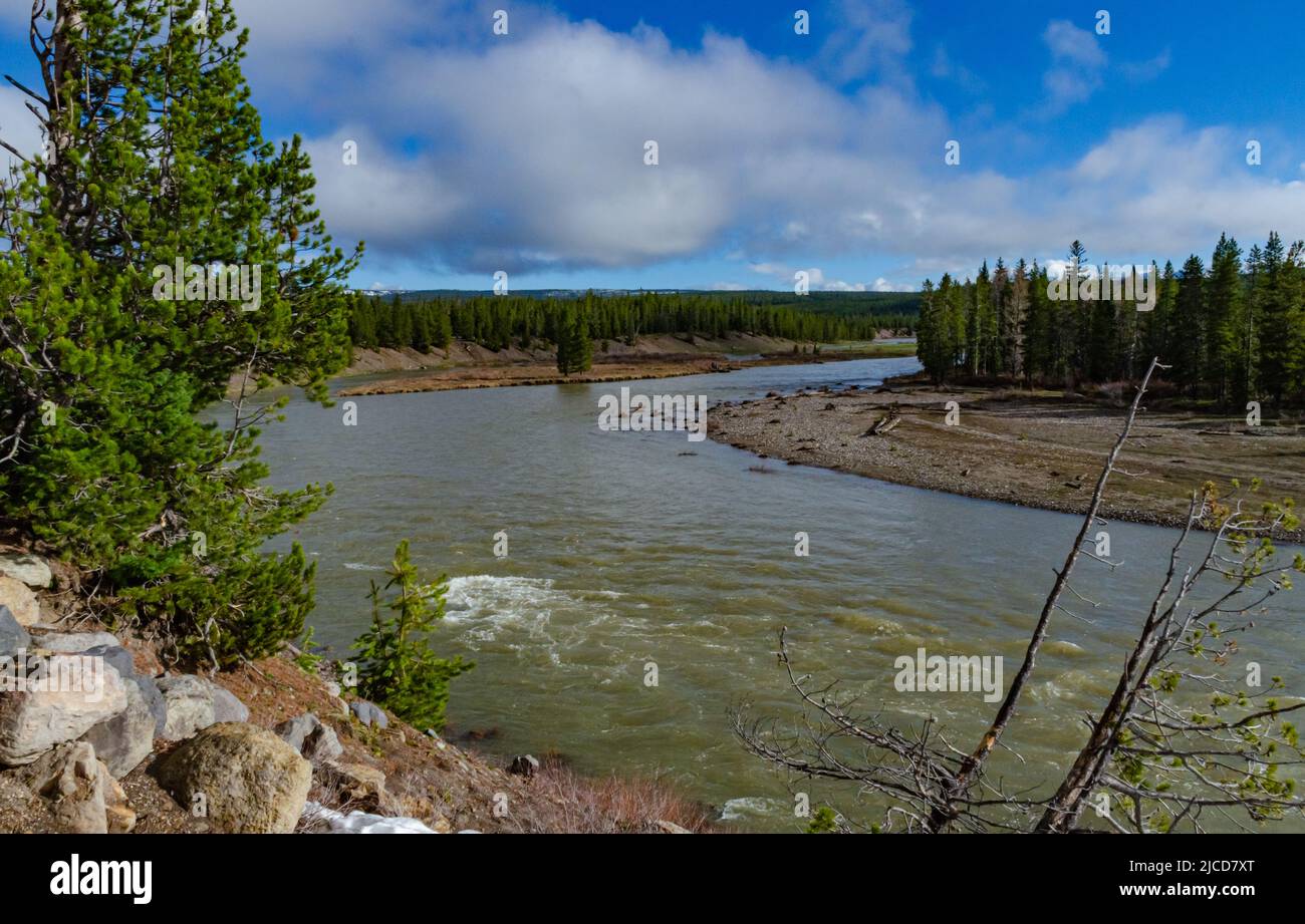 View of a fast river with muddy water in spring in Wyoming, USA Stock ...