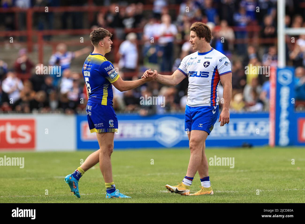 Old team mates Matty Ashton #5 of Warrington Wolves and Tom Lineham #5 ...