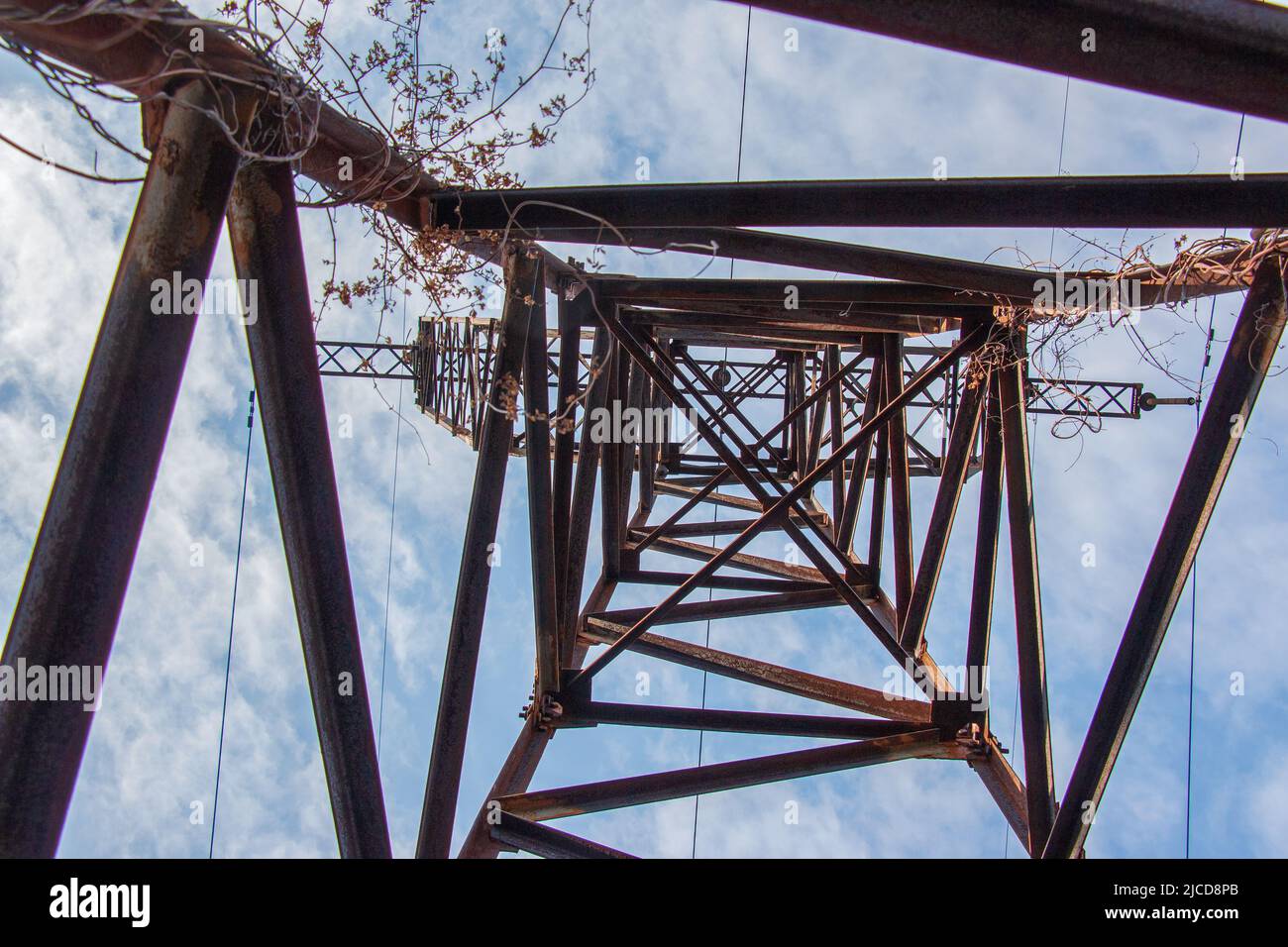 Close-up view of an electric tower with a beautiful blue sky background ...