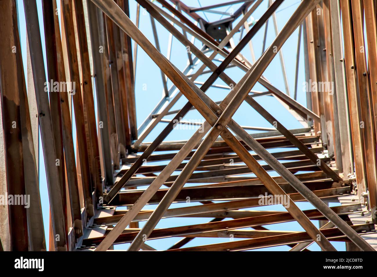 Close-up view of an electric tower with a beautiful blue sky background ...