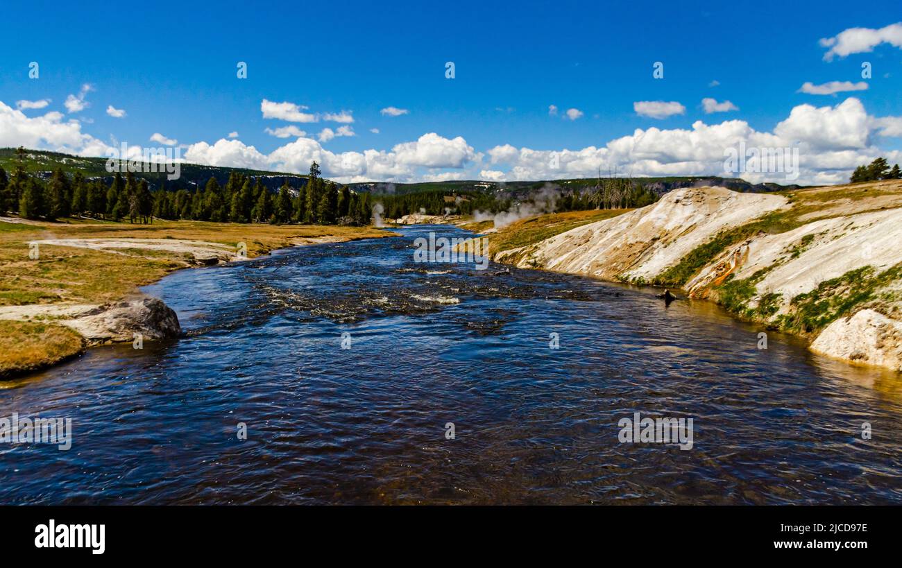 River with warm water in the valley of the Yellowstone National Park ...