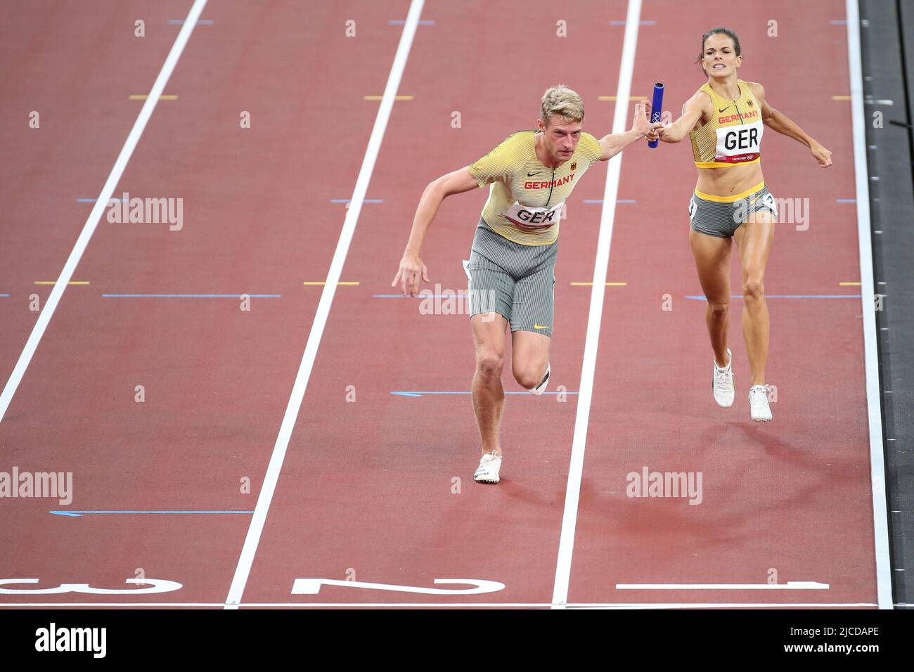 JULY 31st, 2021 - TOKYO, JAPAN: Nadine Gonska passes the relay Manuel ...