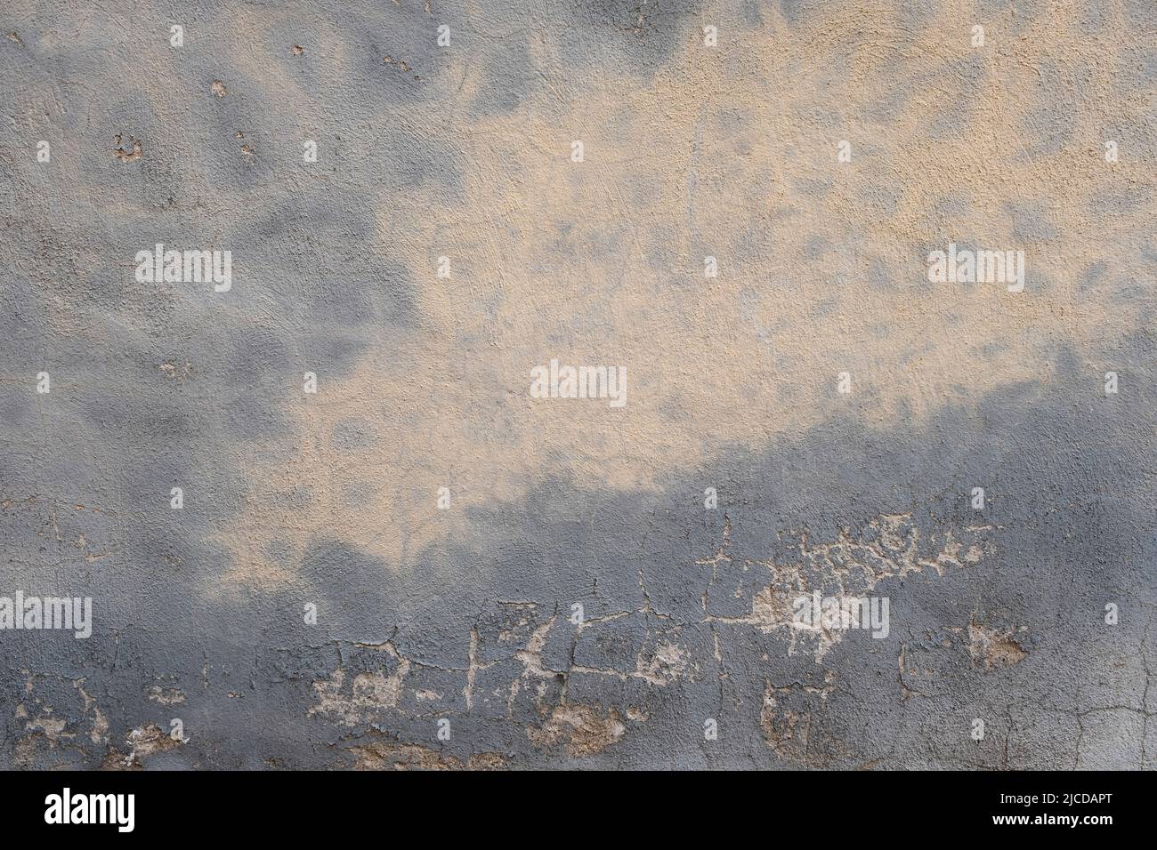 Plastered wall with damp stain and peeling paint, urban grungy ...