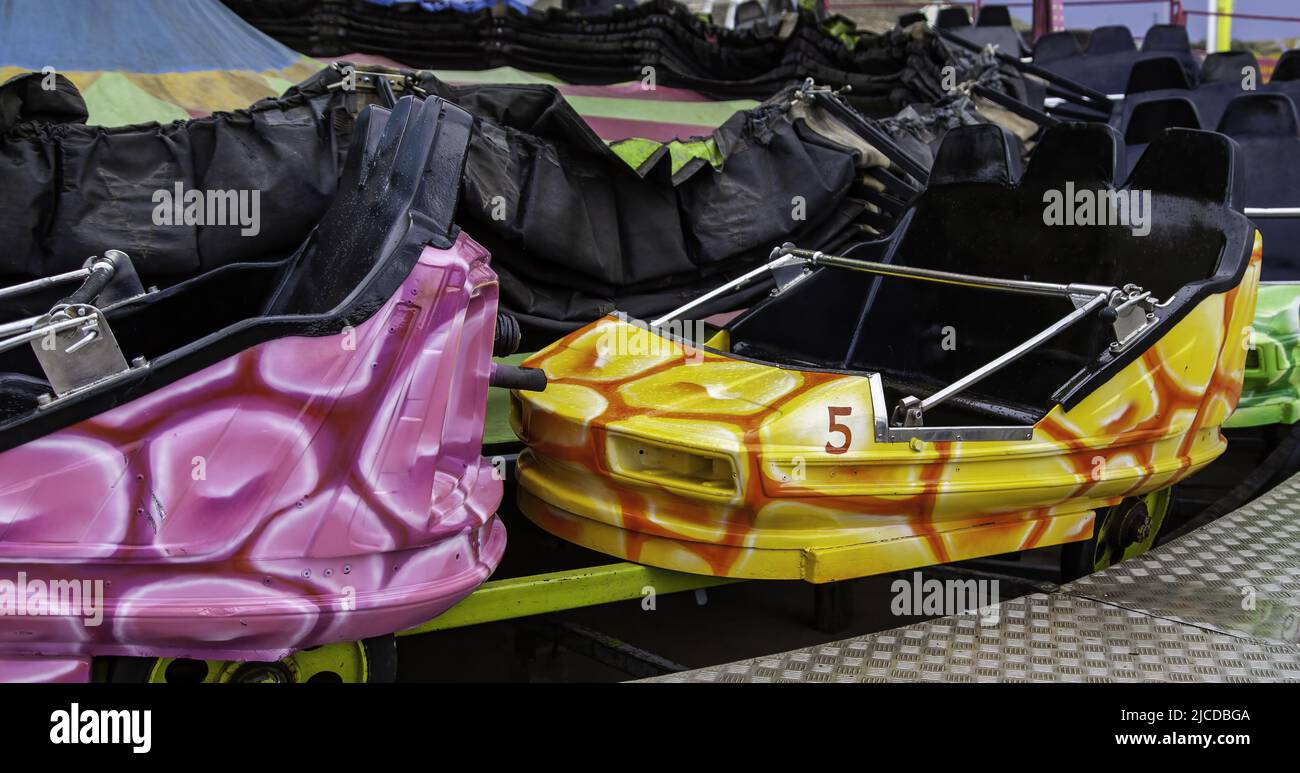 Detail of seats of a fair, fun and party attraction Stock Photo - Alamy