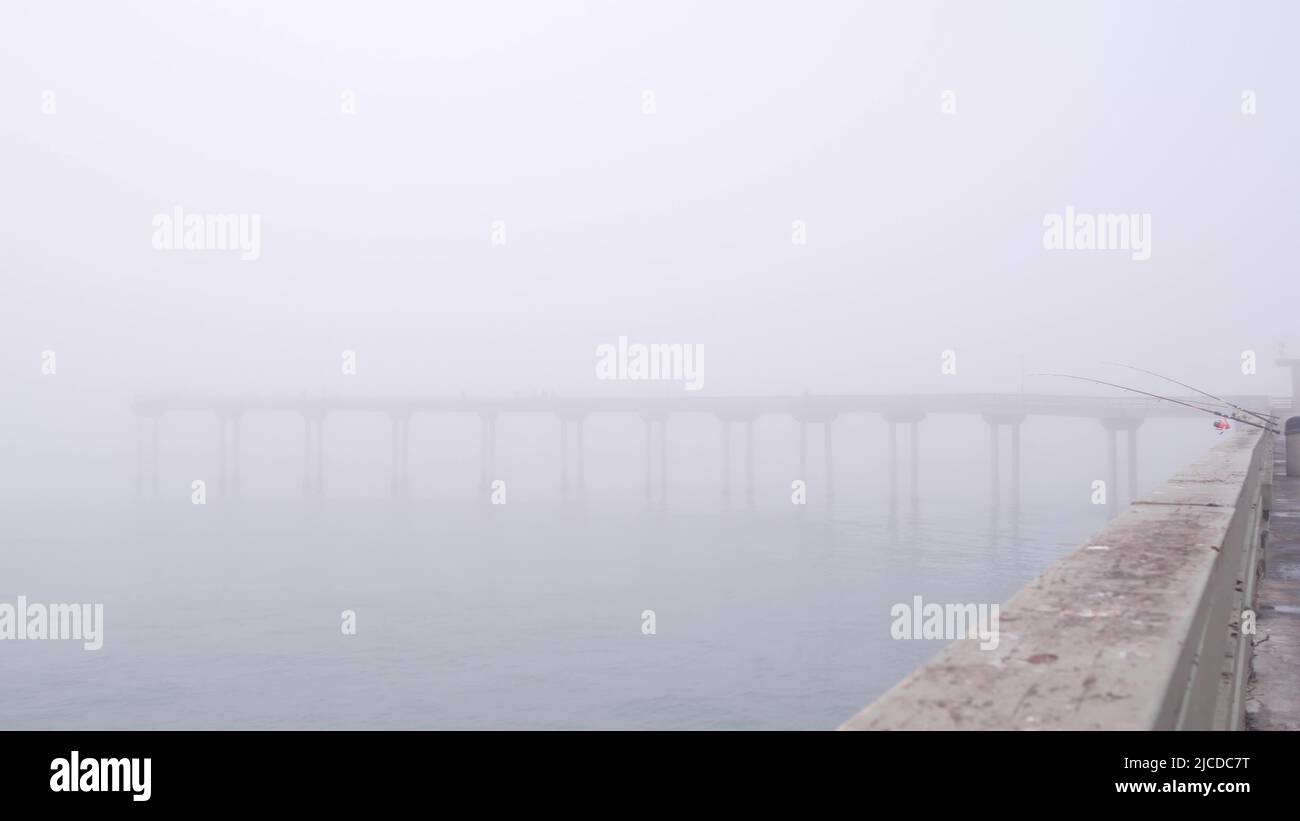 Wooden Ocean Beach pier in fog, misty California coast, USA. Foggy ...