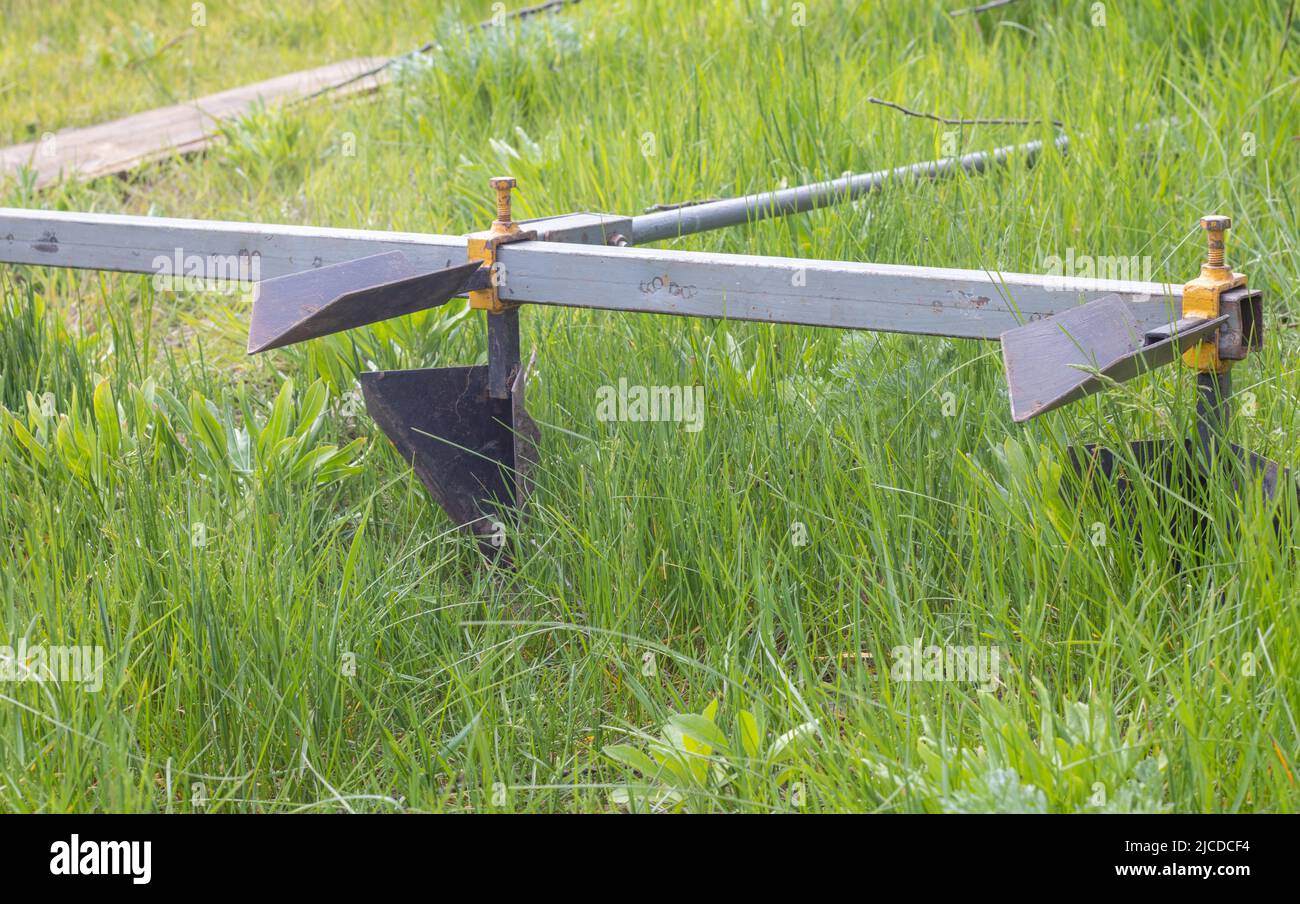 Agricultural manual metal plow on the field. Plowing the land before ...