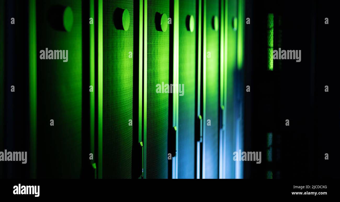 Image of close up of empty corridor with row of blue and green computer ...