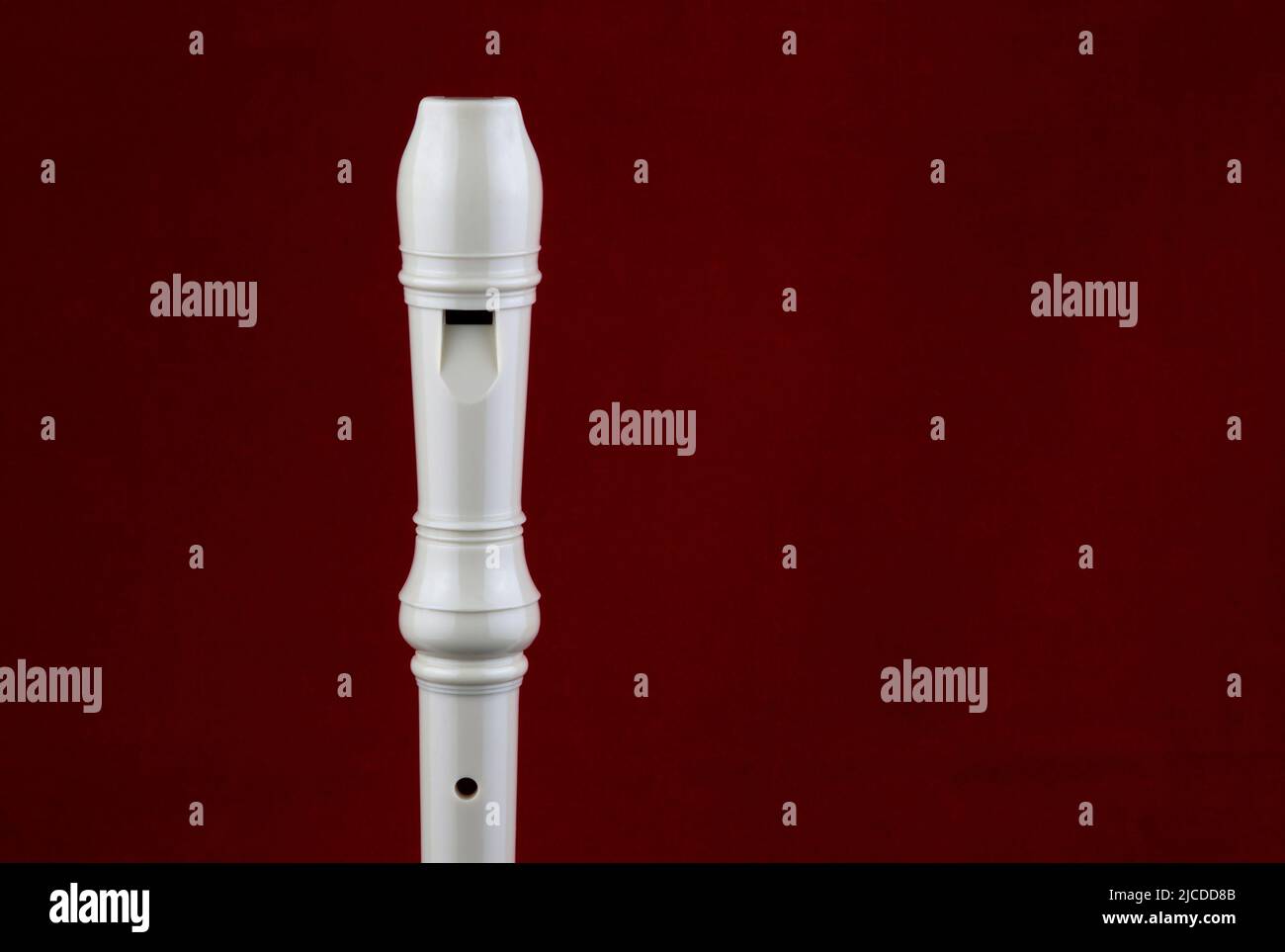 Recorder wind instrument isolated against a red background Stock Photo ...