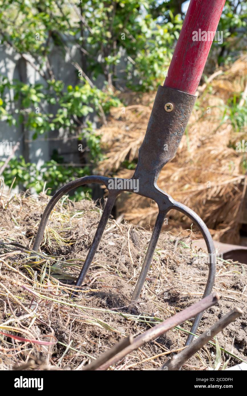 Fork with red handle for composting, recycling lawn and garden waste ...