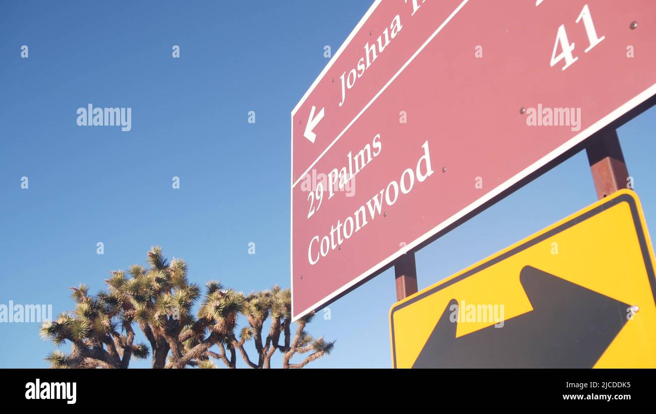 Crossroad sign with direction arrows on road intersection, California ...
