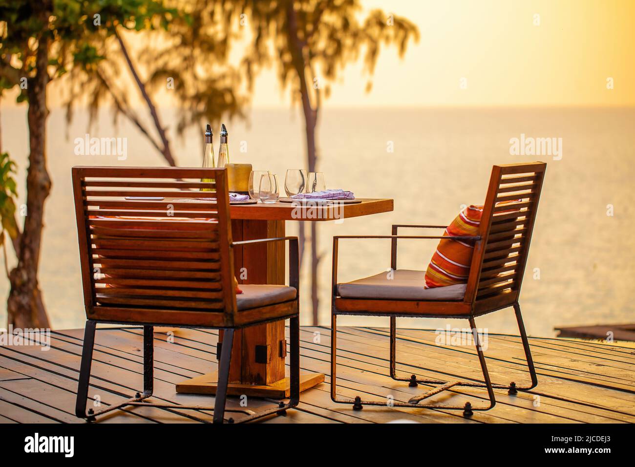 Sea sunset in modern luxury restaurant with terrace. Luxury hotel or ...