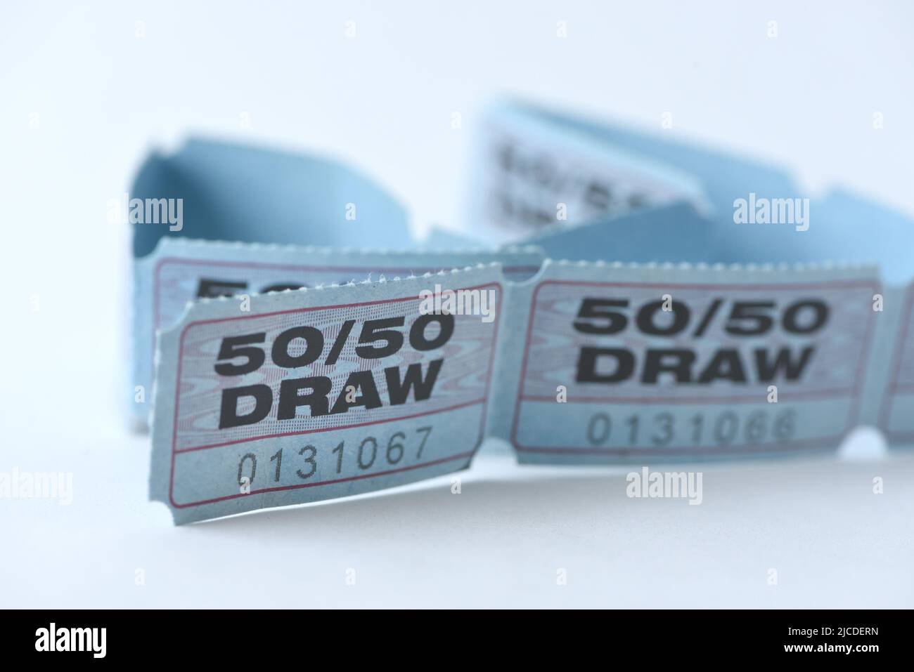 A close up view of a series of 50/50 draw tickets Stock Photo - Alamy