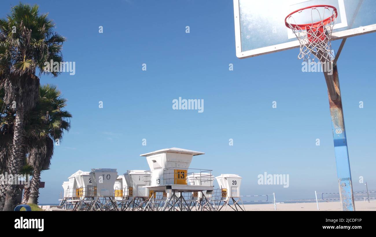 Palm trees and basketball sport field or court on beach, California ...