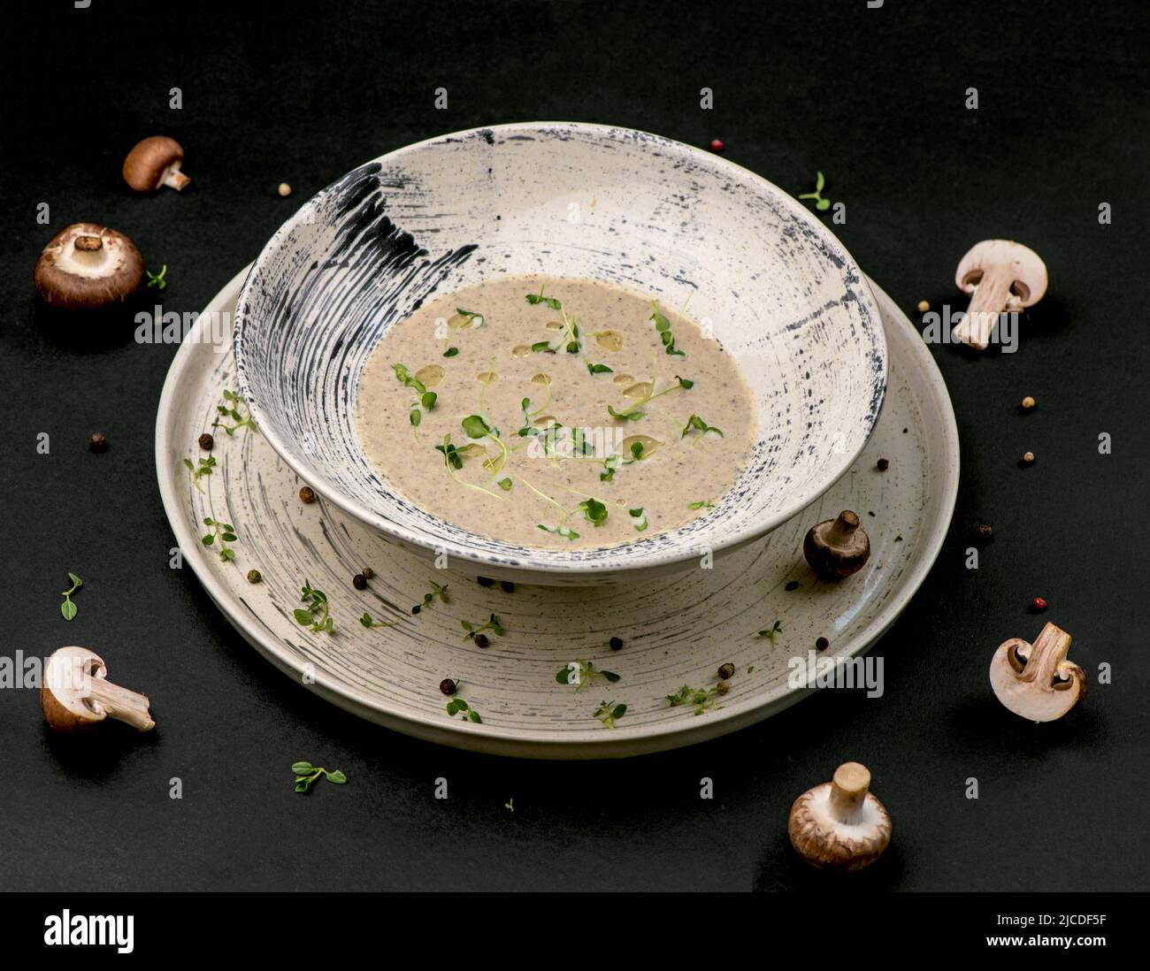 mushroom-soup-of-chicken-broth-mushrooms-cherry-tomato-served-in-a
