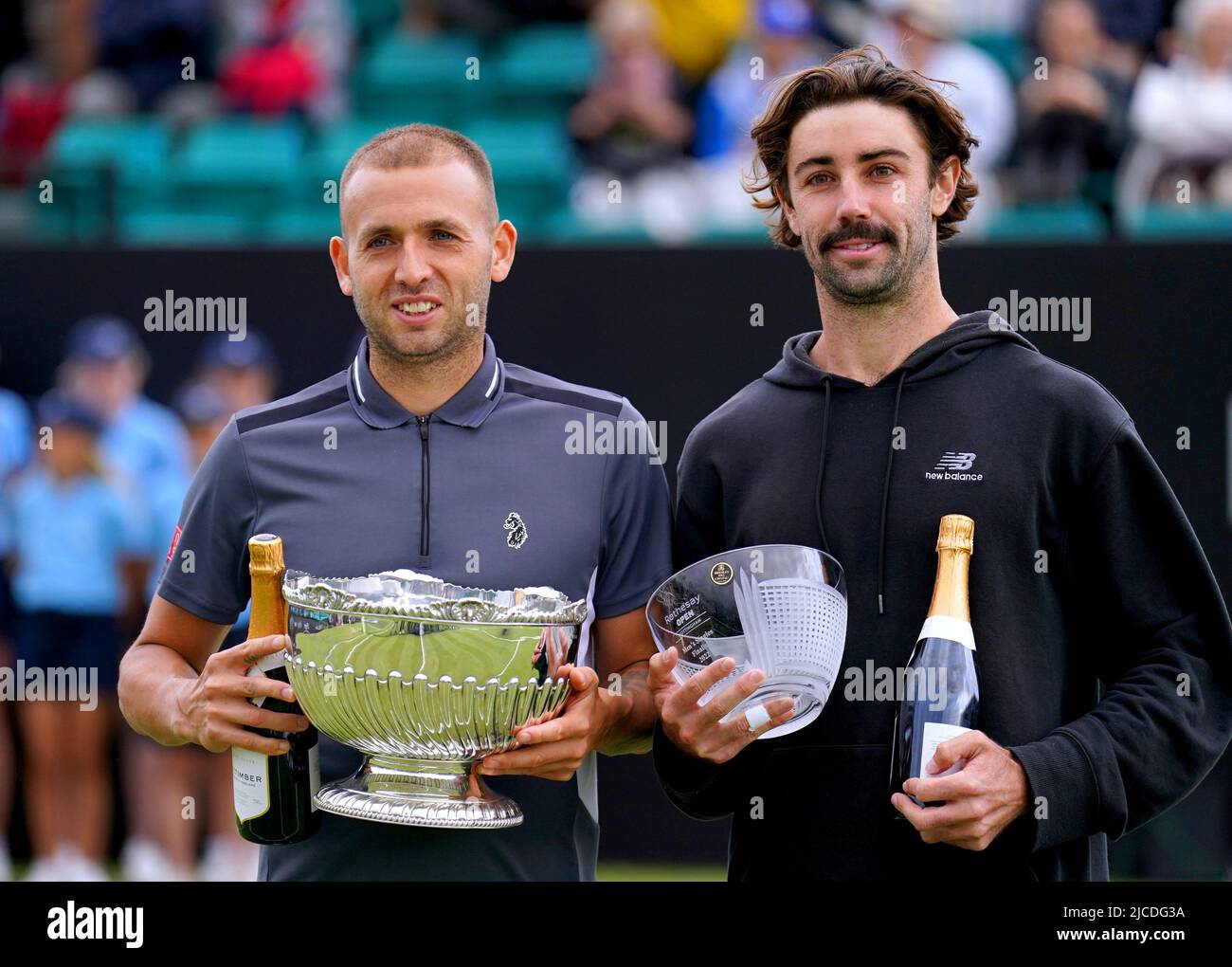 Great Britain's Dan Evans (left) with the trophy after winning the men ...