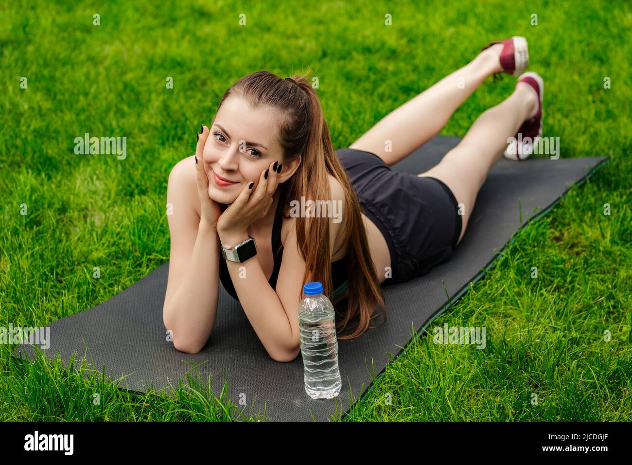 Young Brunette Girl Smiling Happy Wearing Sportive Clothes On City Park