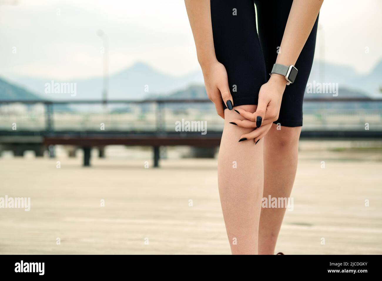 Young caucasian woman wearing black sports bra standing on city park ...