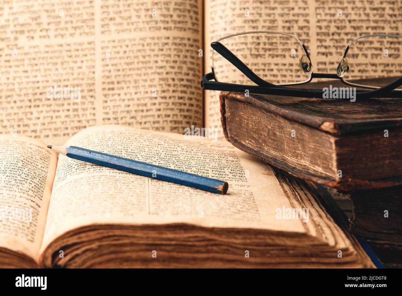 Old worn shabby jewish books, open pages of machzor and siddur. Reading ...