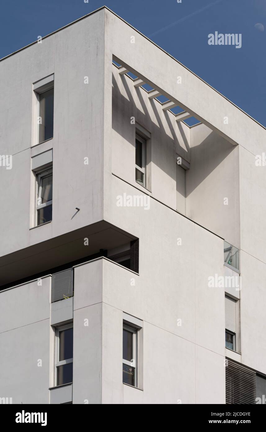 Eco-neighborhood. View of a designer white building Stock Photo - Alamy
