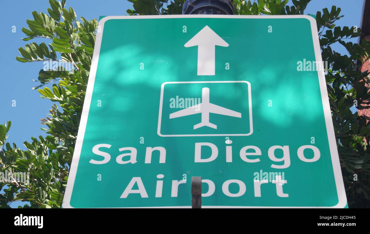 Airport green road sign with direction arrow and plane icon, San Diego ...