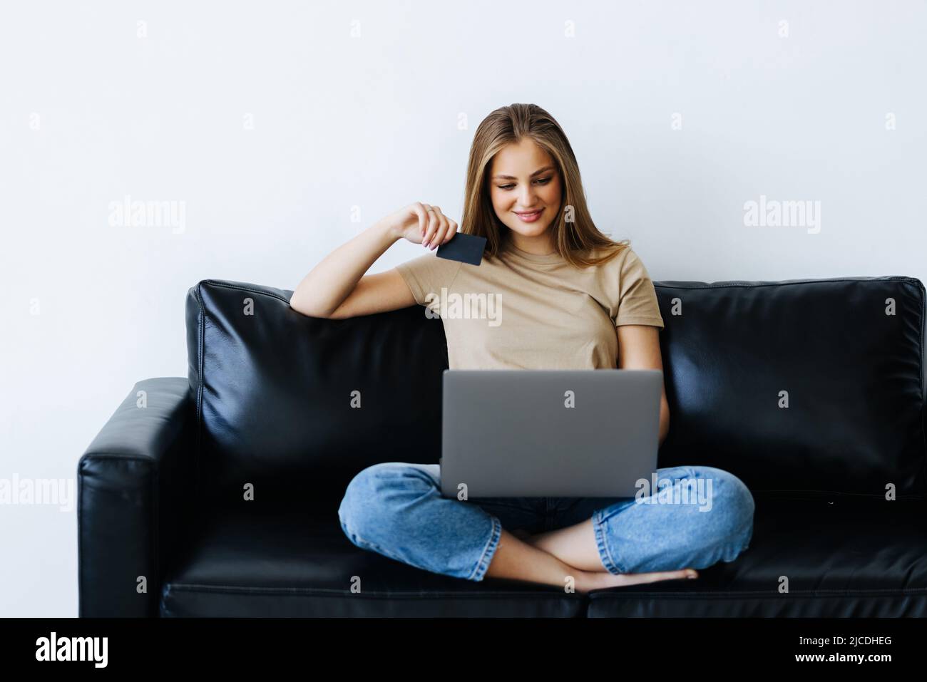 Full length portrait of cheerful charming person sit hold netbook ...