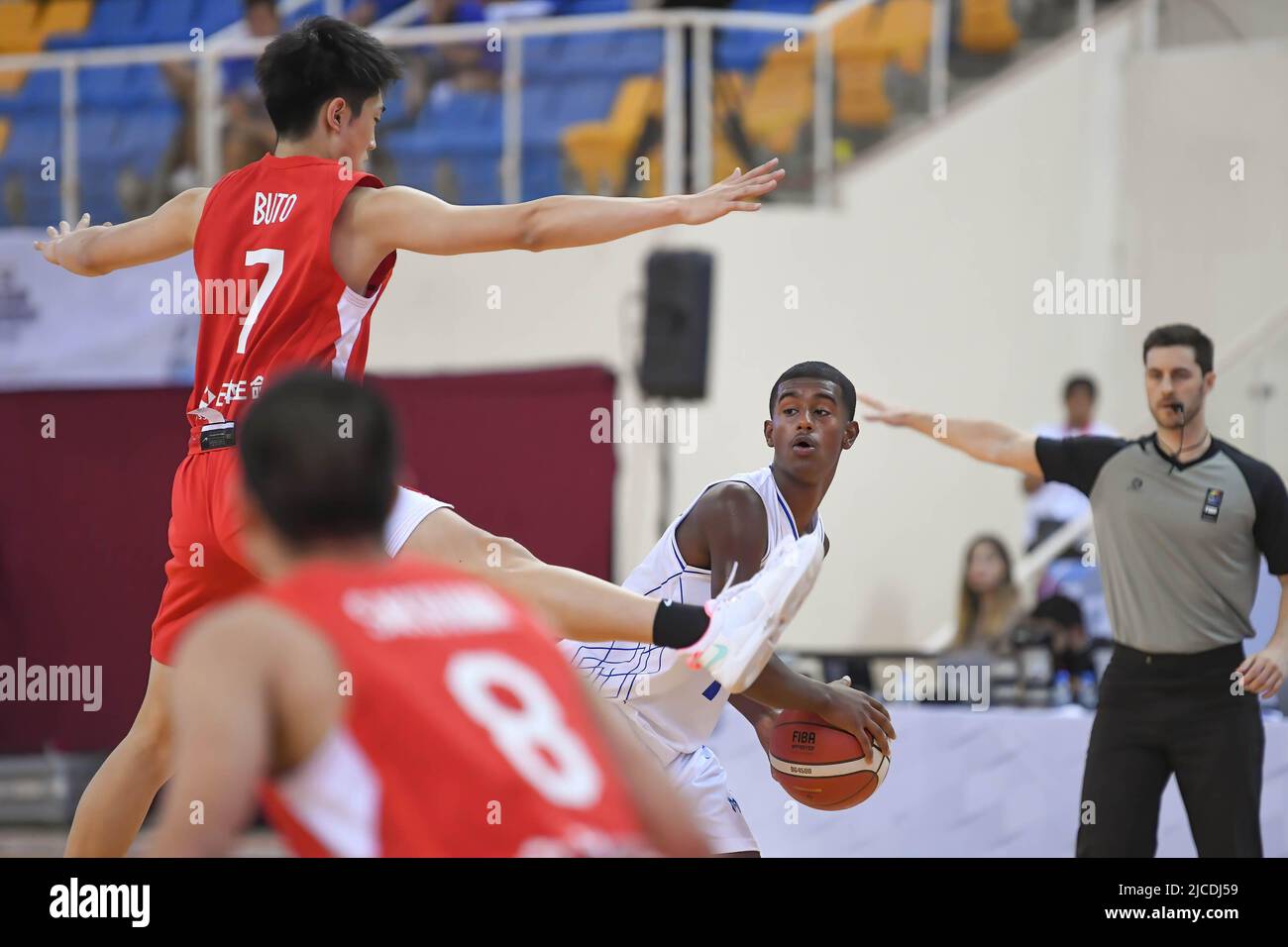 Doha, Qatar. 12th June, 2022. Shuntaro Buto (L) of Japan Basketball team and Adel F A H Alsaied ...