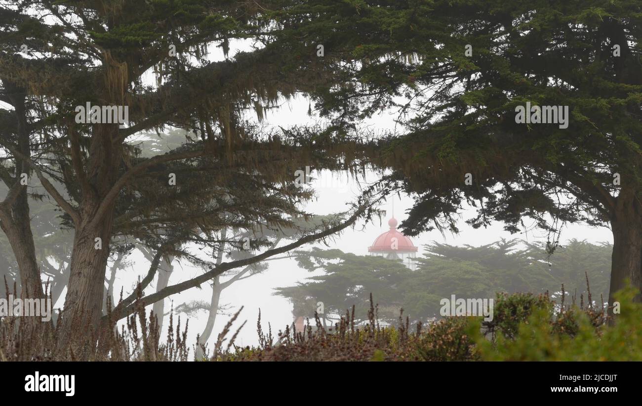 Point Pinos old historic lighthouse fresnel lens glowing, foggy rainy ...