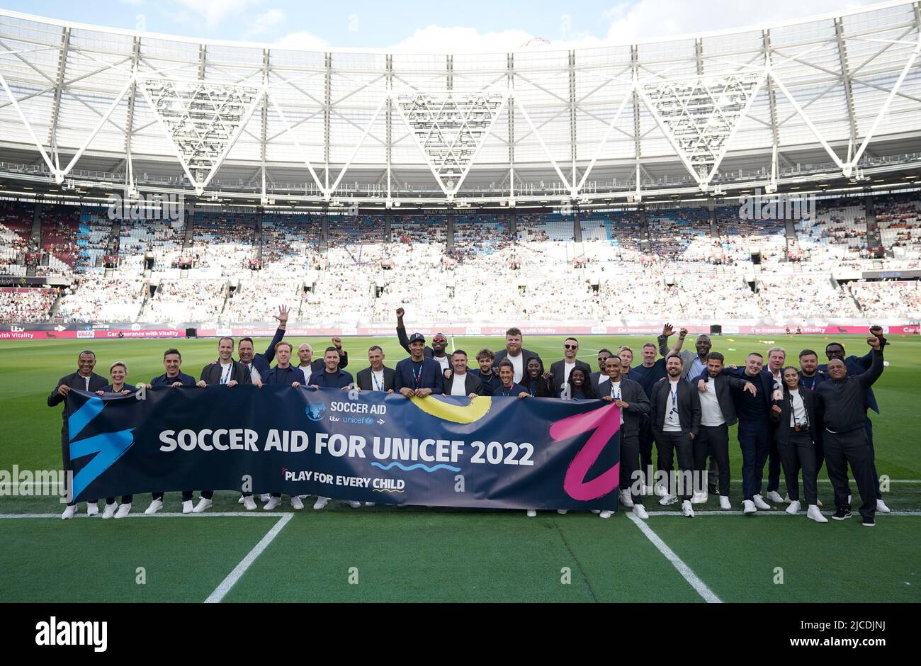 The players pose for a group photo before the Soccer Aid for UNICEF ...