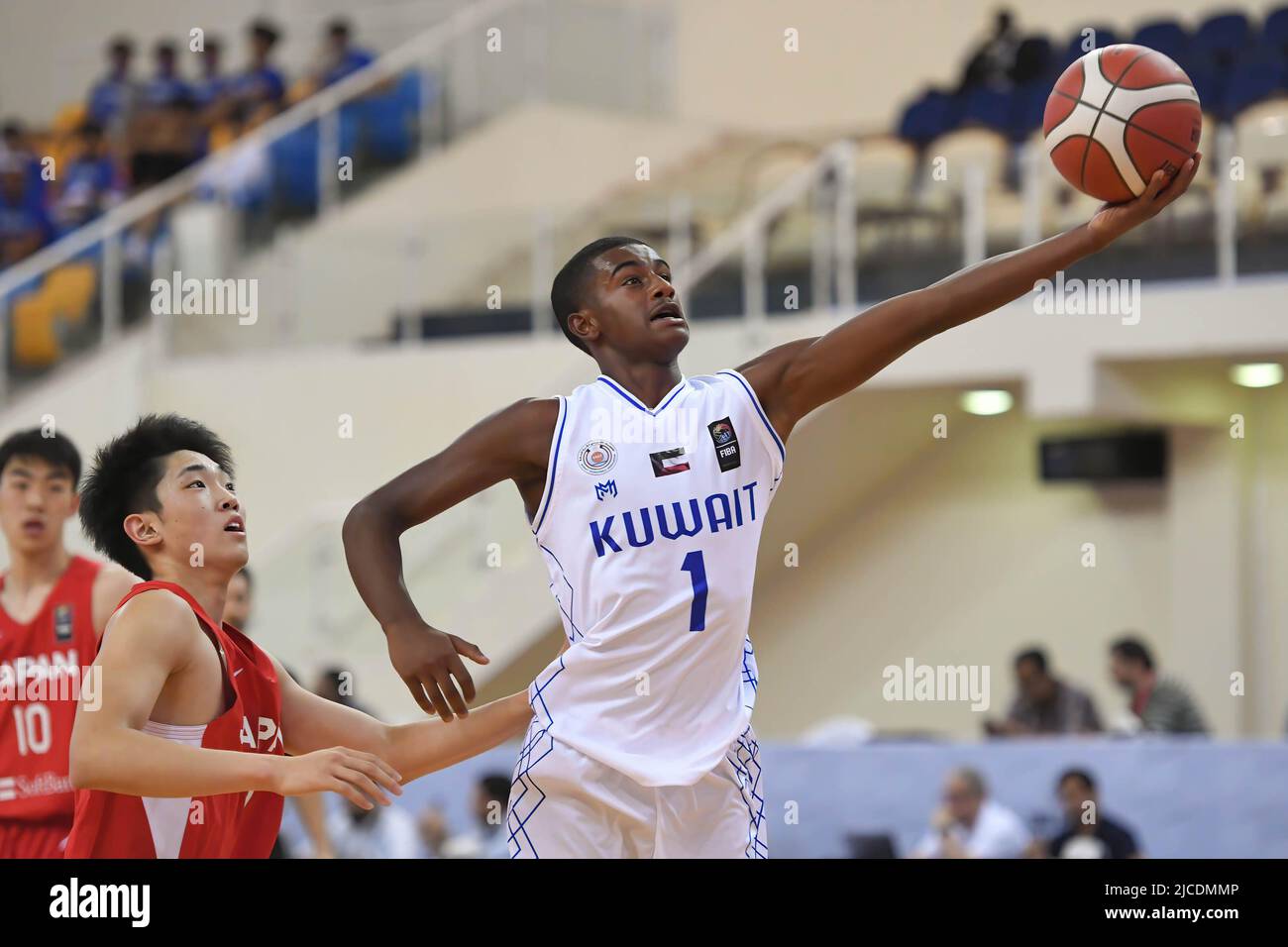 Doha, Qatar. 12th June, 2022. Shuntaro Buto (L) of Japan Basketball team and Adel F A H Alsaied ...